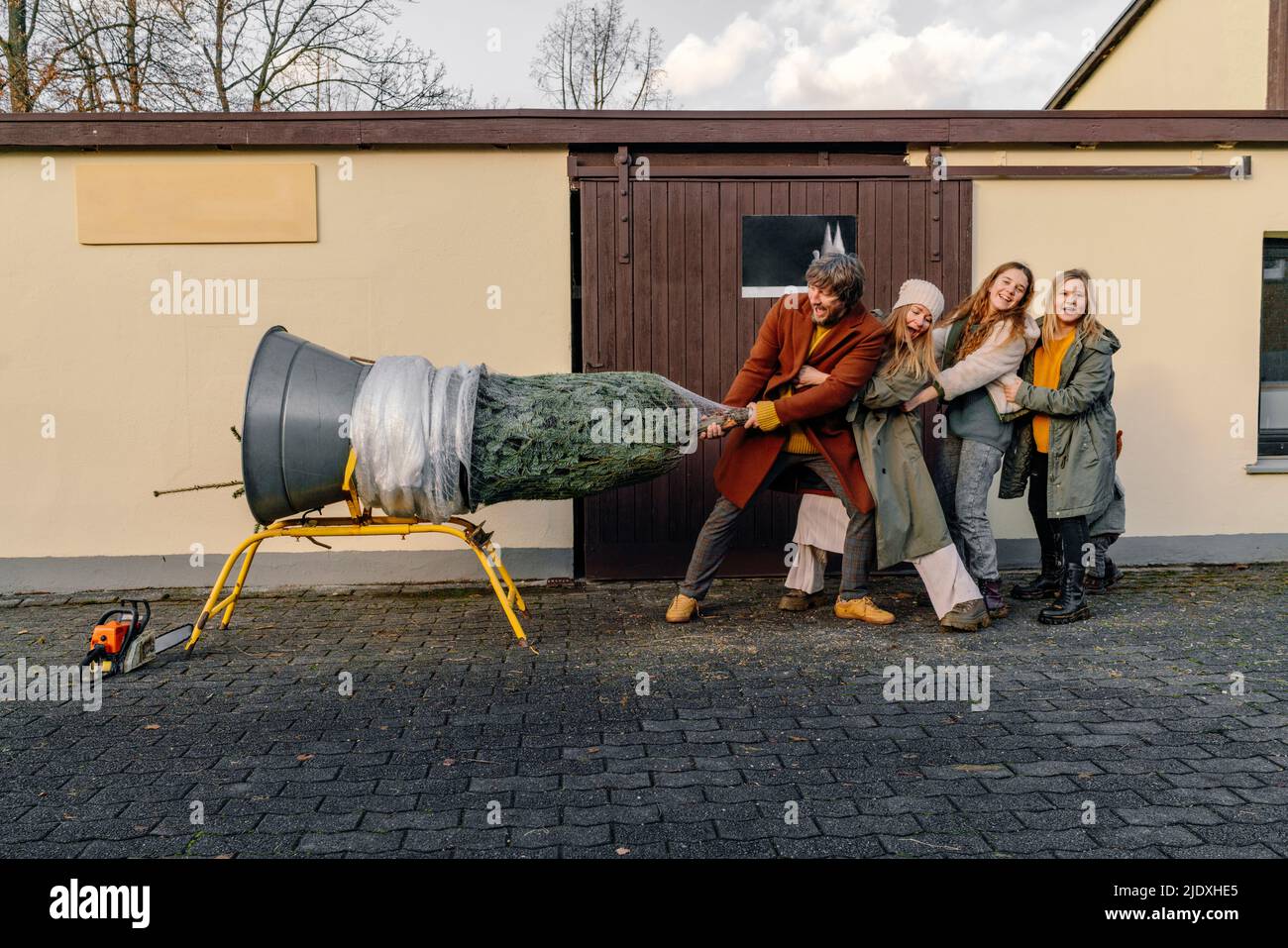 Child dragging tree hi-res stock photography and images - Alamy
