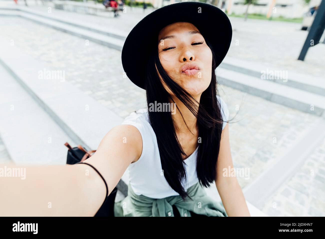 Young asian woman puckering lips hi-res stock photography and images ...
