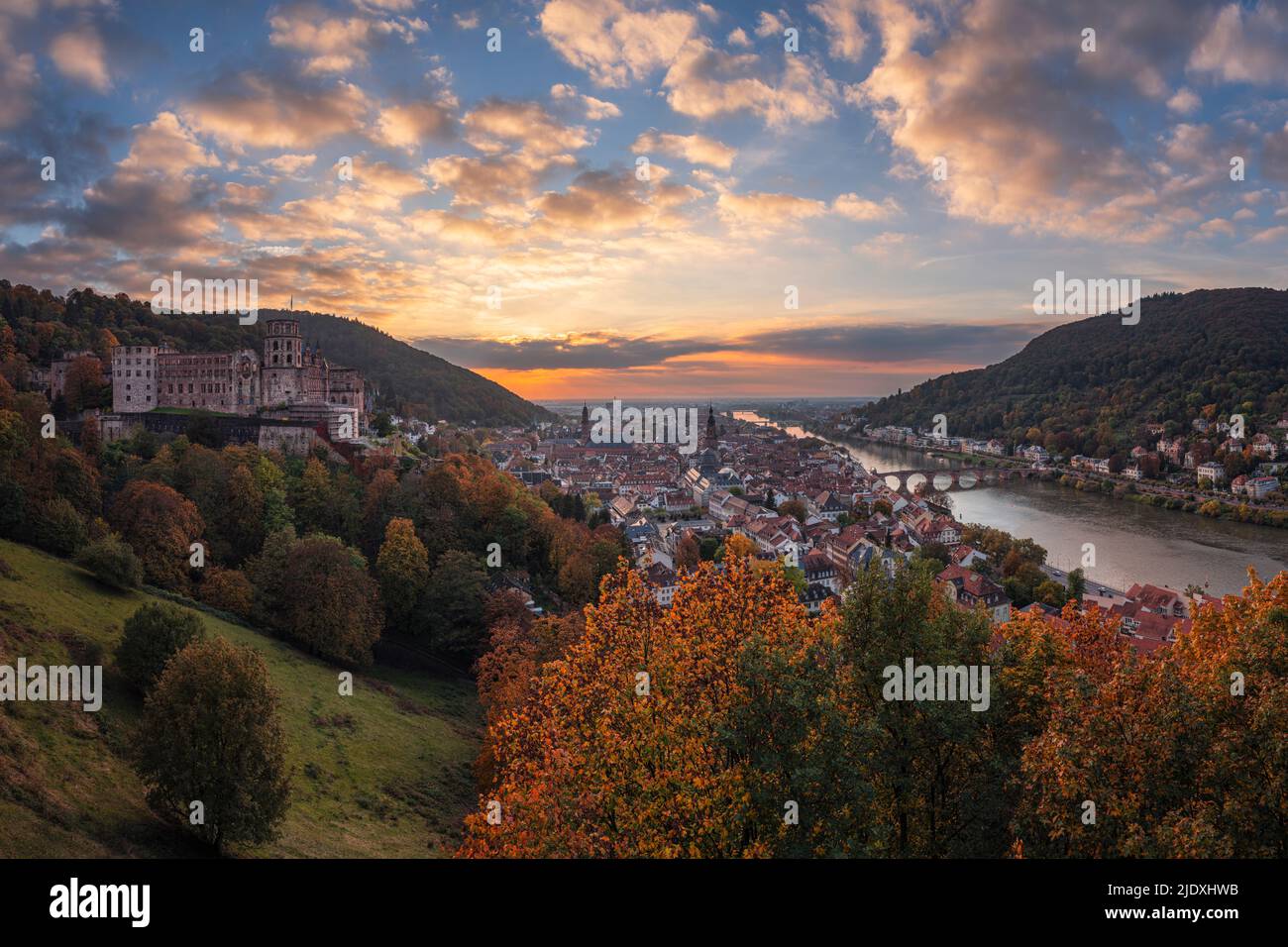 Germany, Baden-Wurttemberg, Heidelberg, Heidelberg Castle and surrounding town at autumn sunset ...