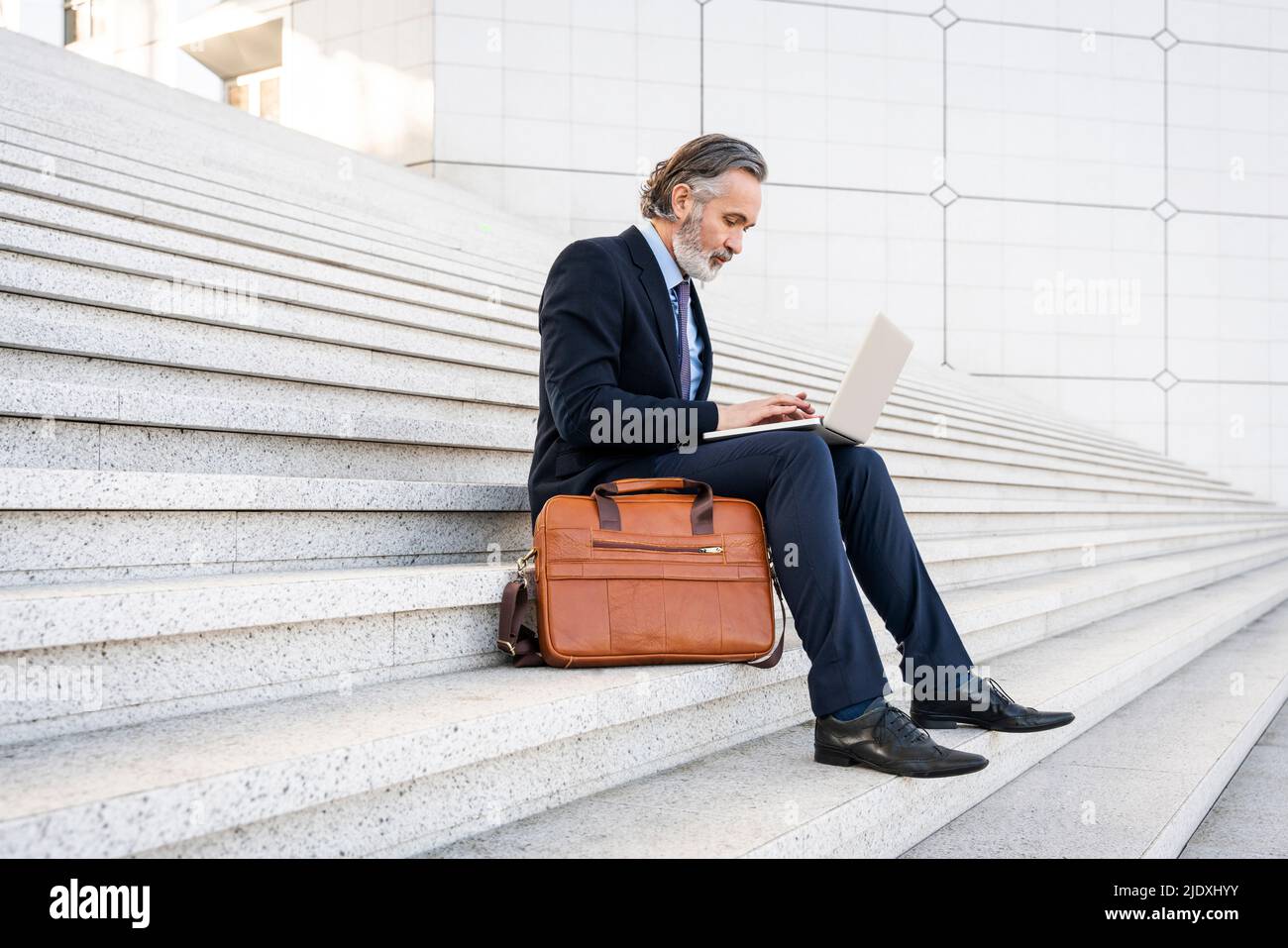 Mature men sitting side side steps hi-res stock photography and images ...