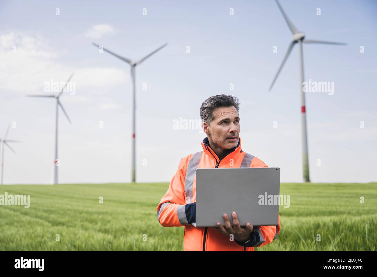 Person standing in wind farm hi-res stock photography and images - Alamy