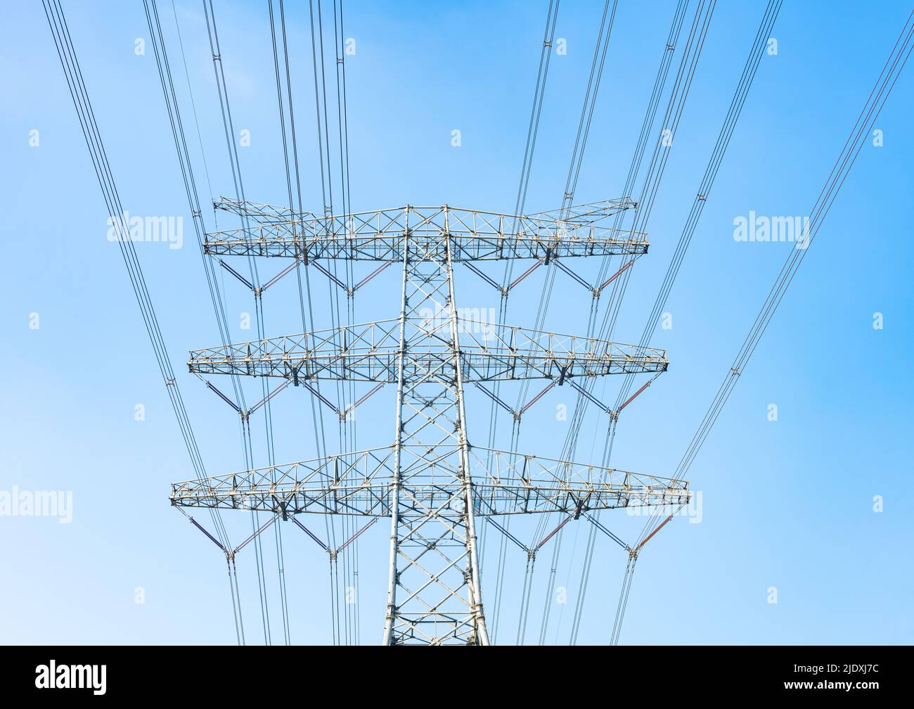 high voltage power pylon in a day time horizontal composition Stock ...