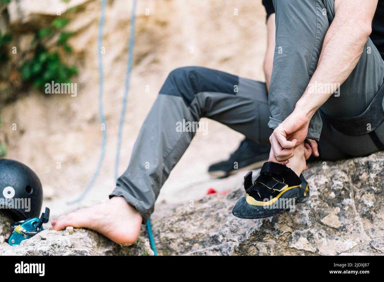 Man wearing boot before going for rock climbing Stock Photo - Alamy