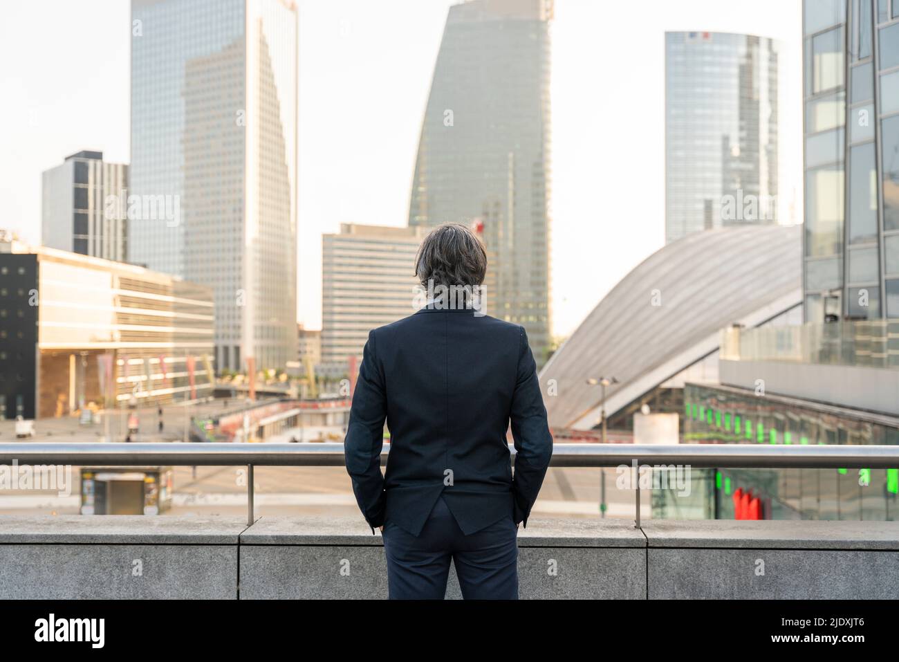 Rear view man standing railing hi-res stock photography and images - Alamy