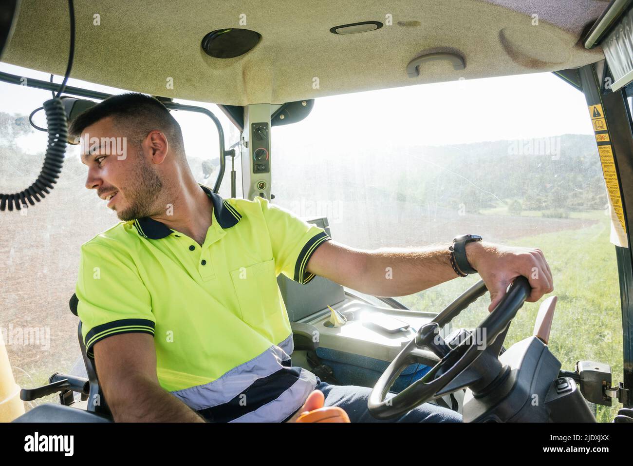 Farmer driving tractor hi-res stock photography and images - Alamy