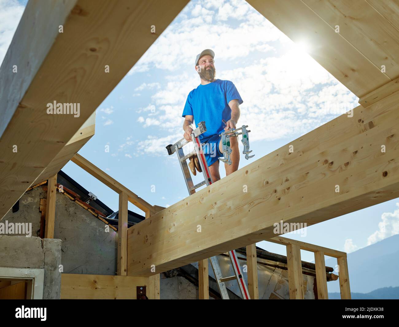 Man standing on ladder hi-res stock photography and images - Alamy