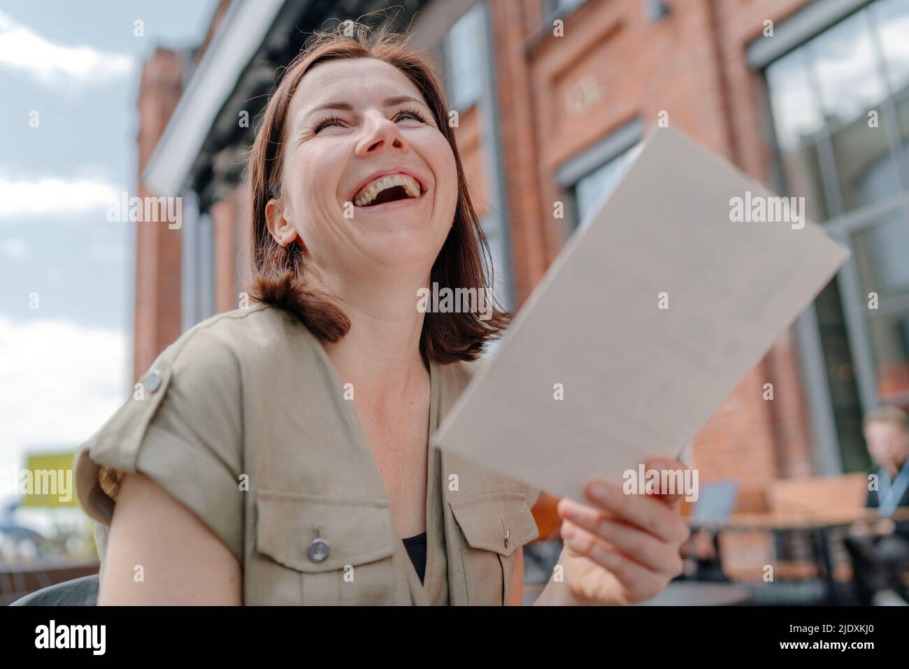 Woman looking menu cafe hi-res stock photography and images - Alamy