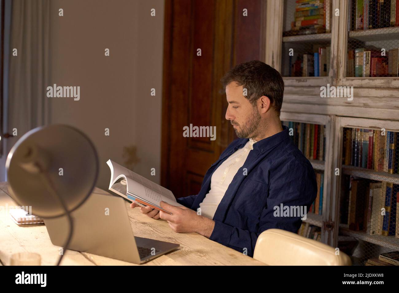 Businessman reading book desk hi-res stock photography and images - Alamy