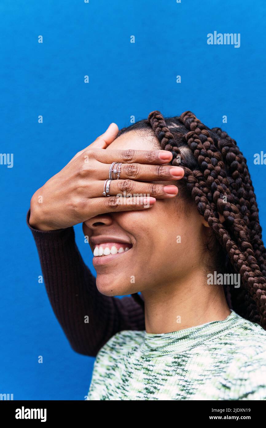 Woman covering friends eyes hi-res stock photography and images - Alamy