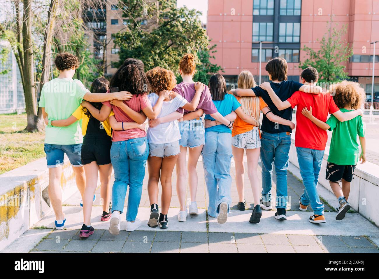 Girl friends walking arm in hi-res stock photography and images - Alamy