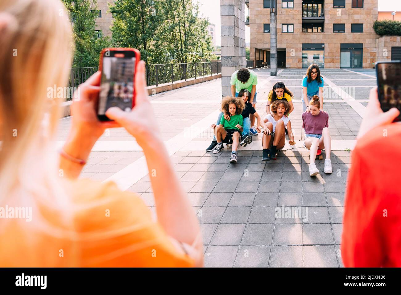 Boy filming friends hi-res stock photography and images - Alamy