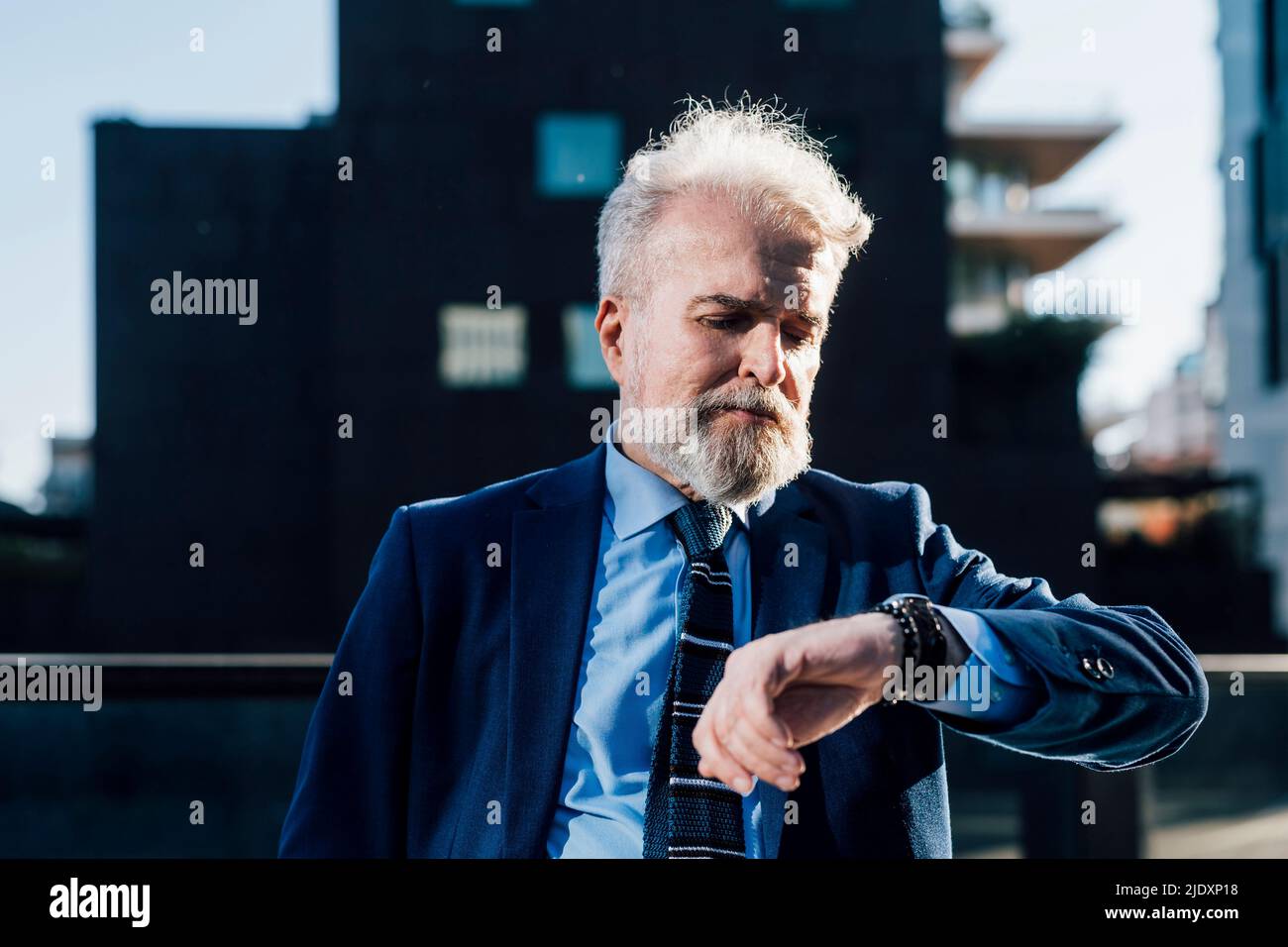 Technology time standing suit watch hi-res stock photography and images ...