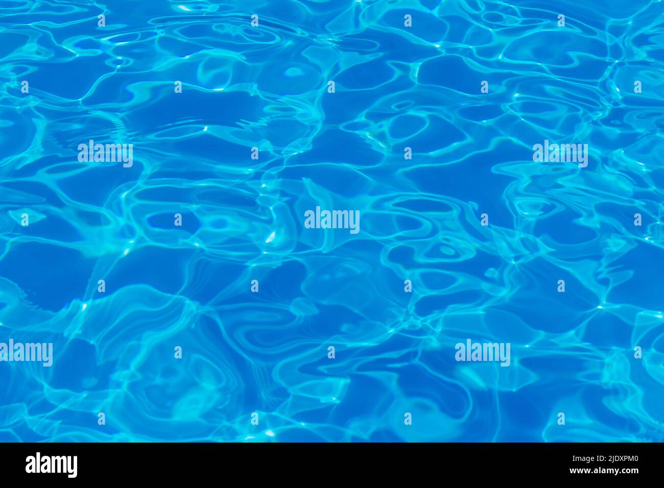 Swimming pool water surface with sparkling light reflections. Aqua ...