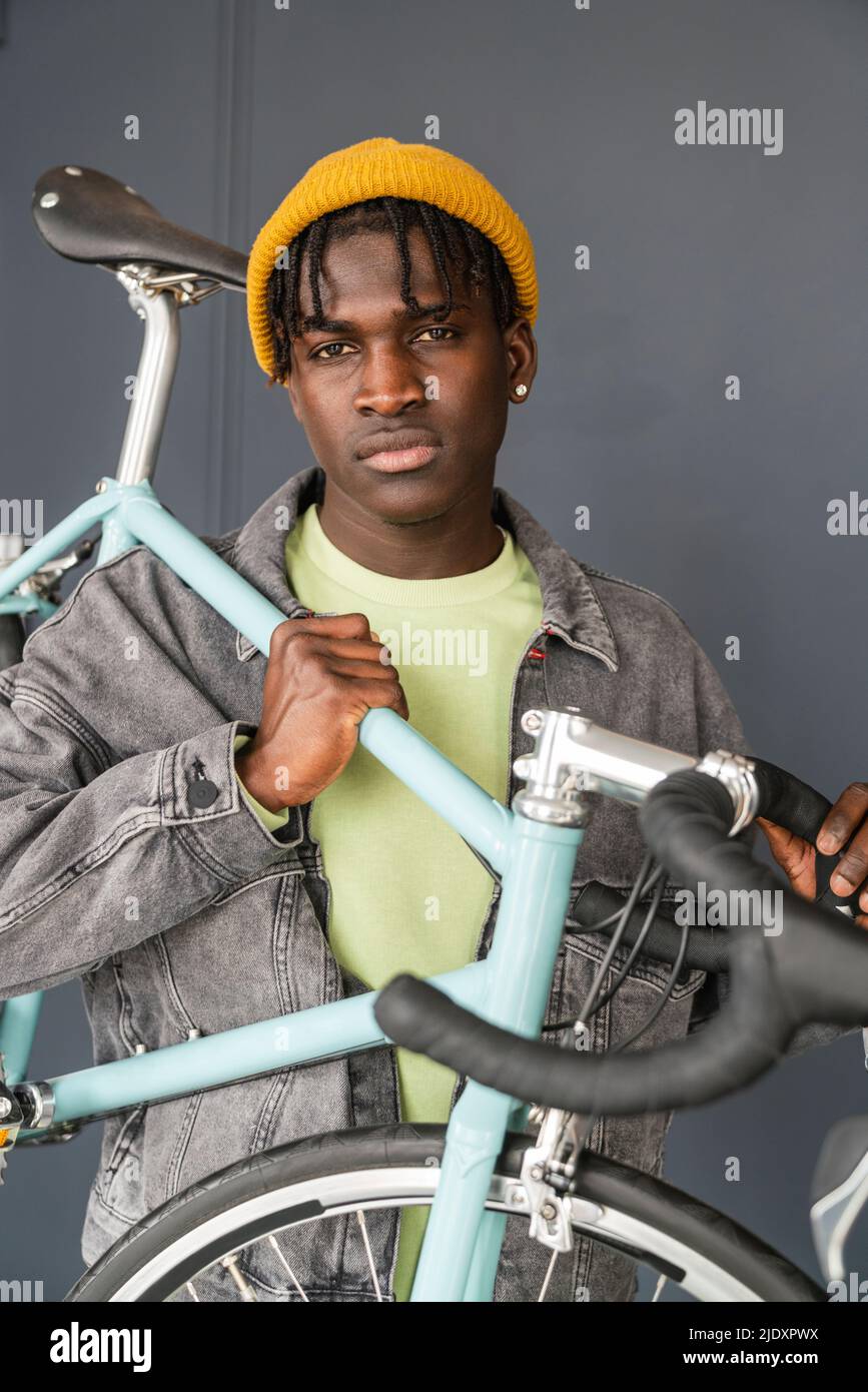 Man in carrying bicycle hi-res stock photography and images - Alamy