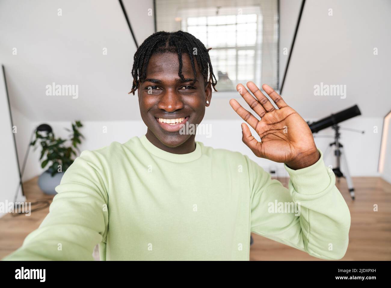 Portrait happy african man waving hi-res stock photography and images ...