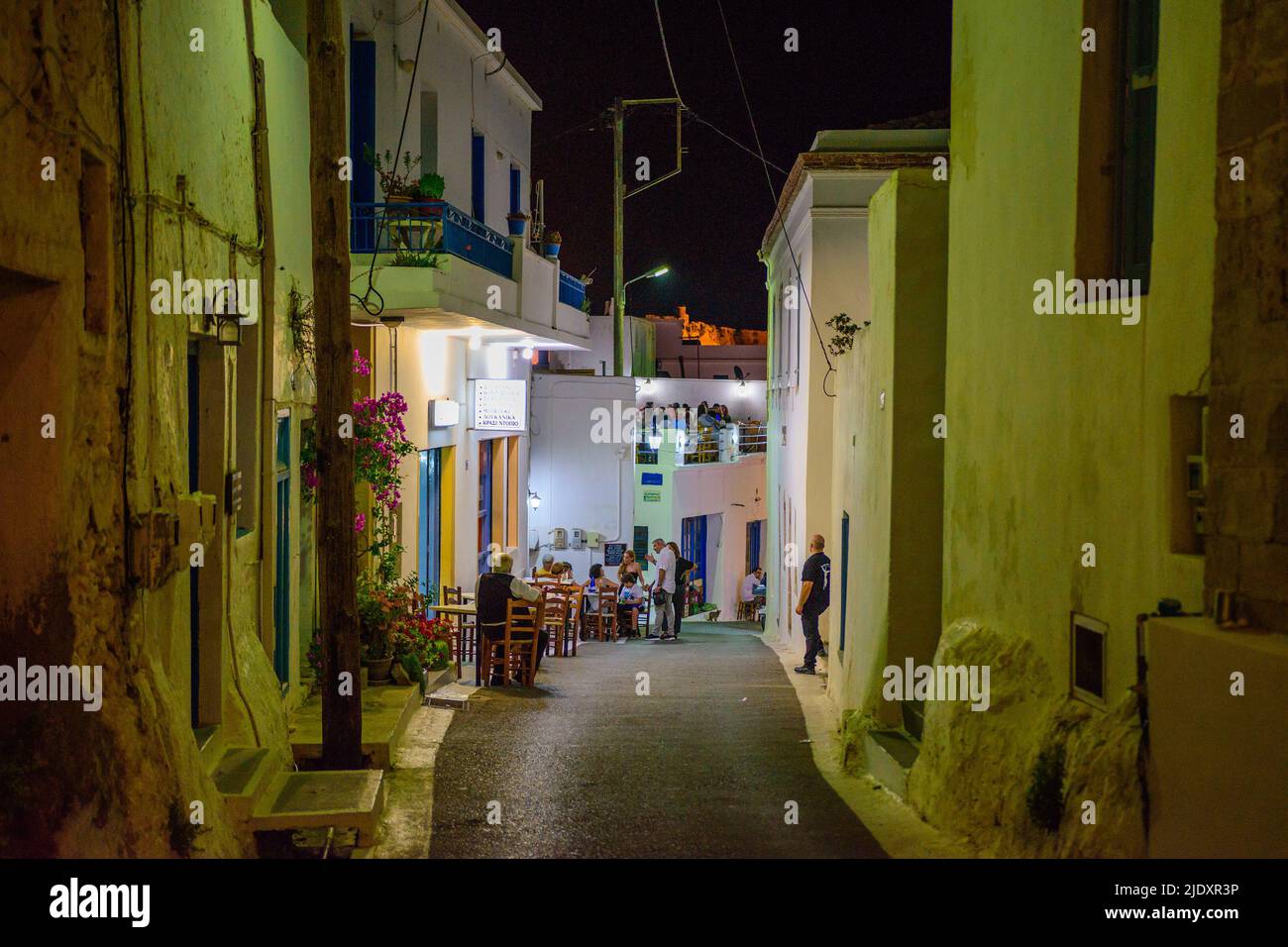 Architectural buildings with people walking in the streets of Chora ...