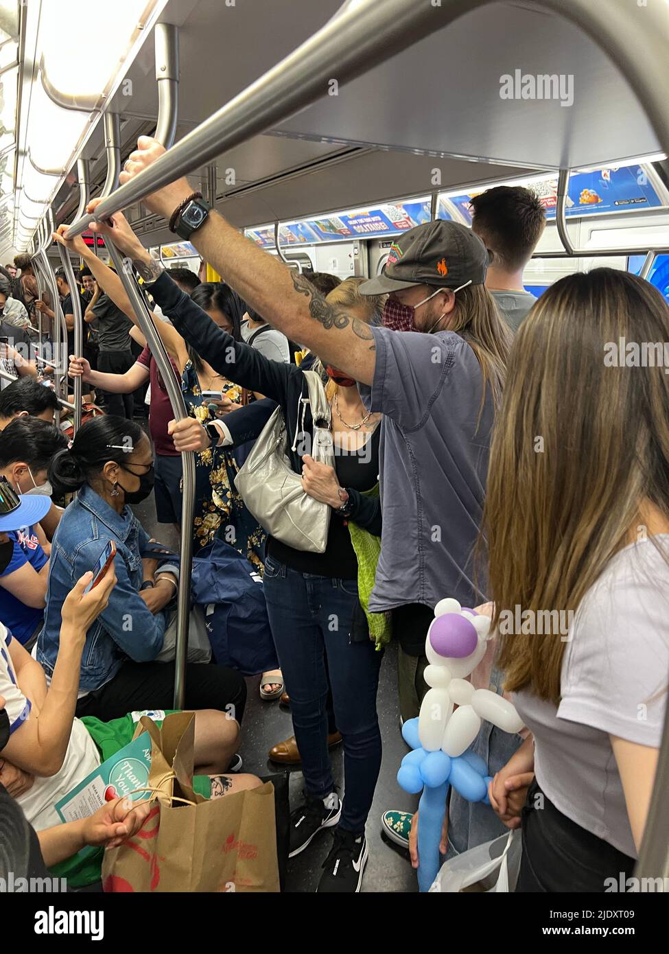Many Riders Still Wear Face Masks On Crowded New York City Subway