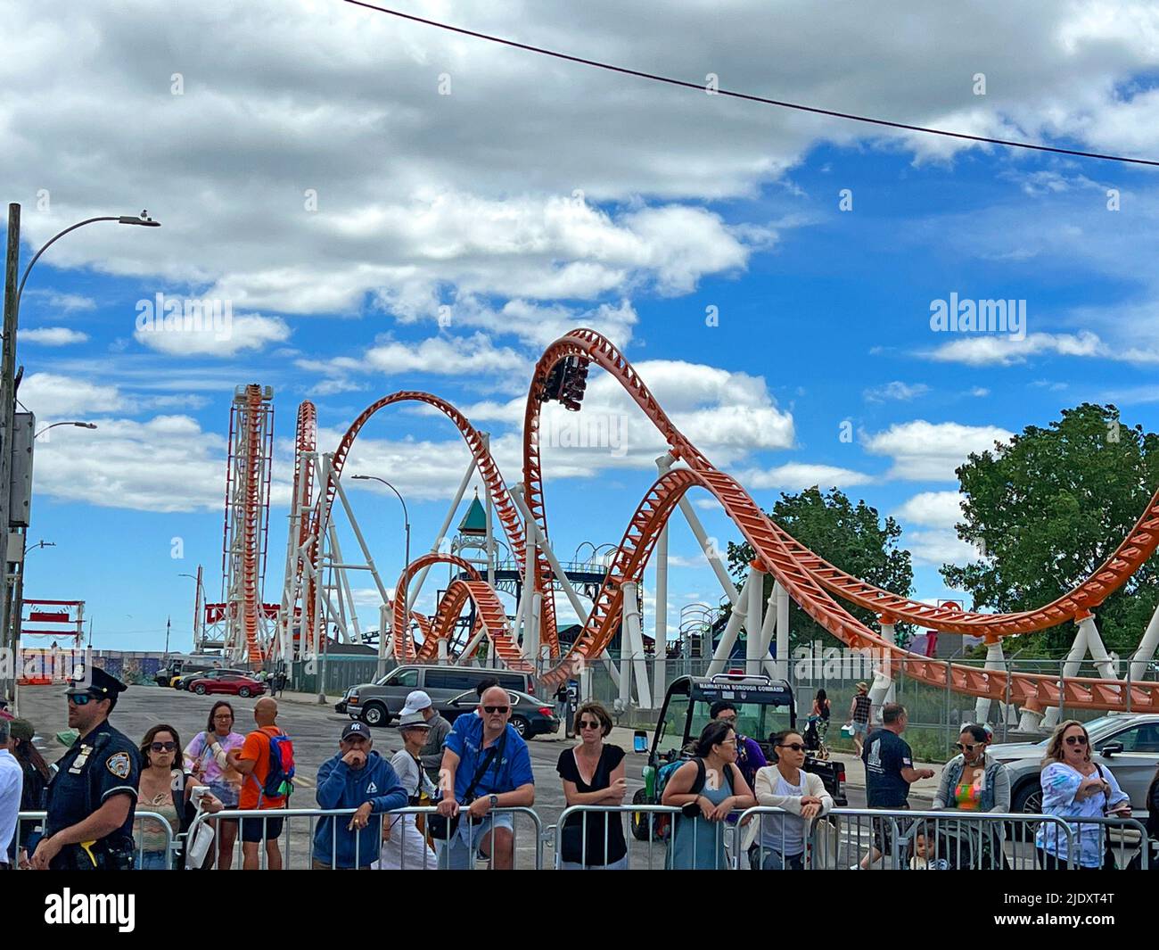 People ride the fast moving Thunderbolt roller coaster at Coney Island ...