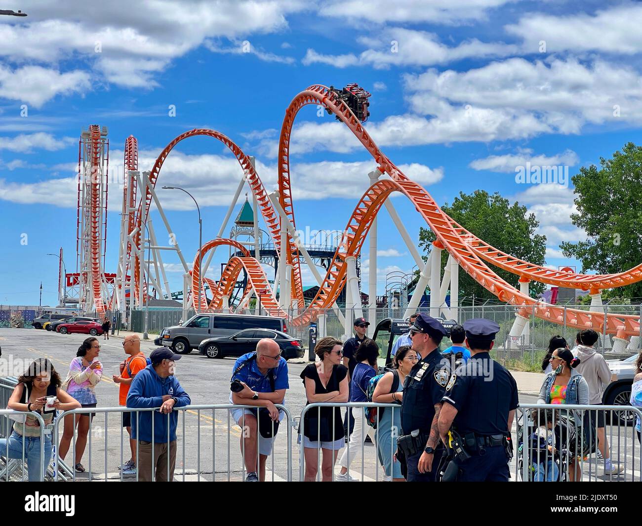 People ride the fast moving Thunderbolt roller coaster at Coney Island ...