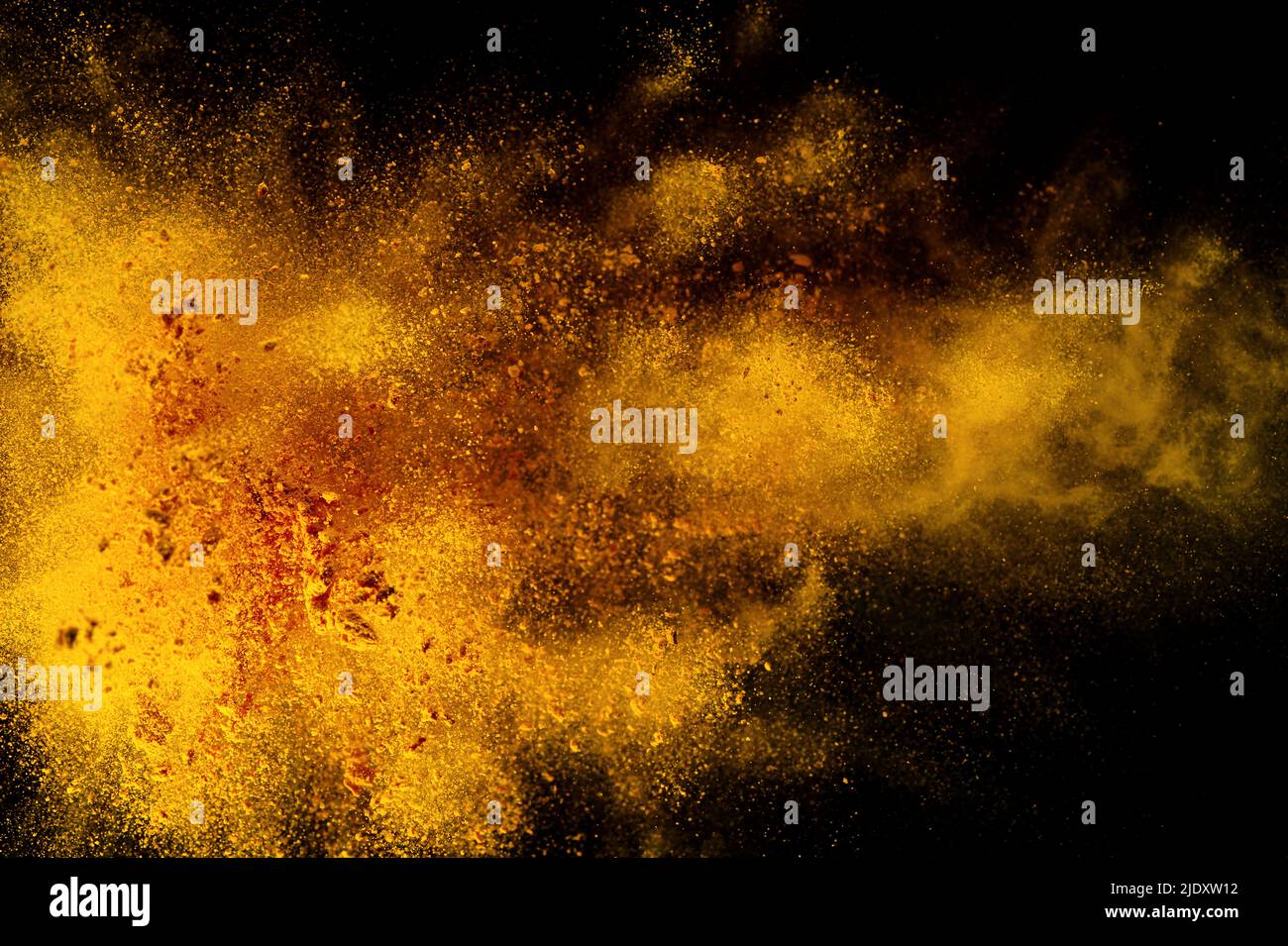 Explosion, Splashes of turmeric on a black background. India Seasoning ...