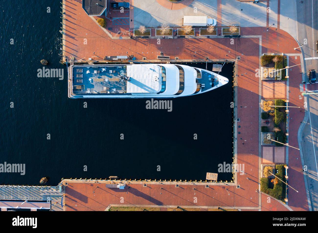 Aerial view top down of a ship anchored in a large slip near downtown ...
