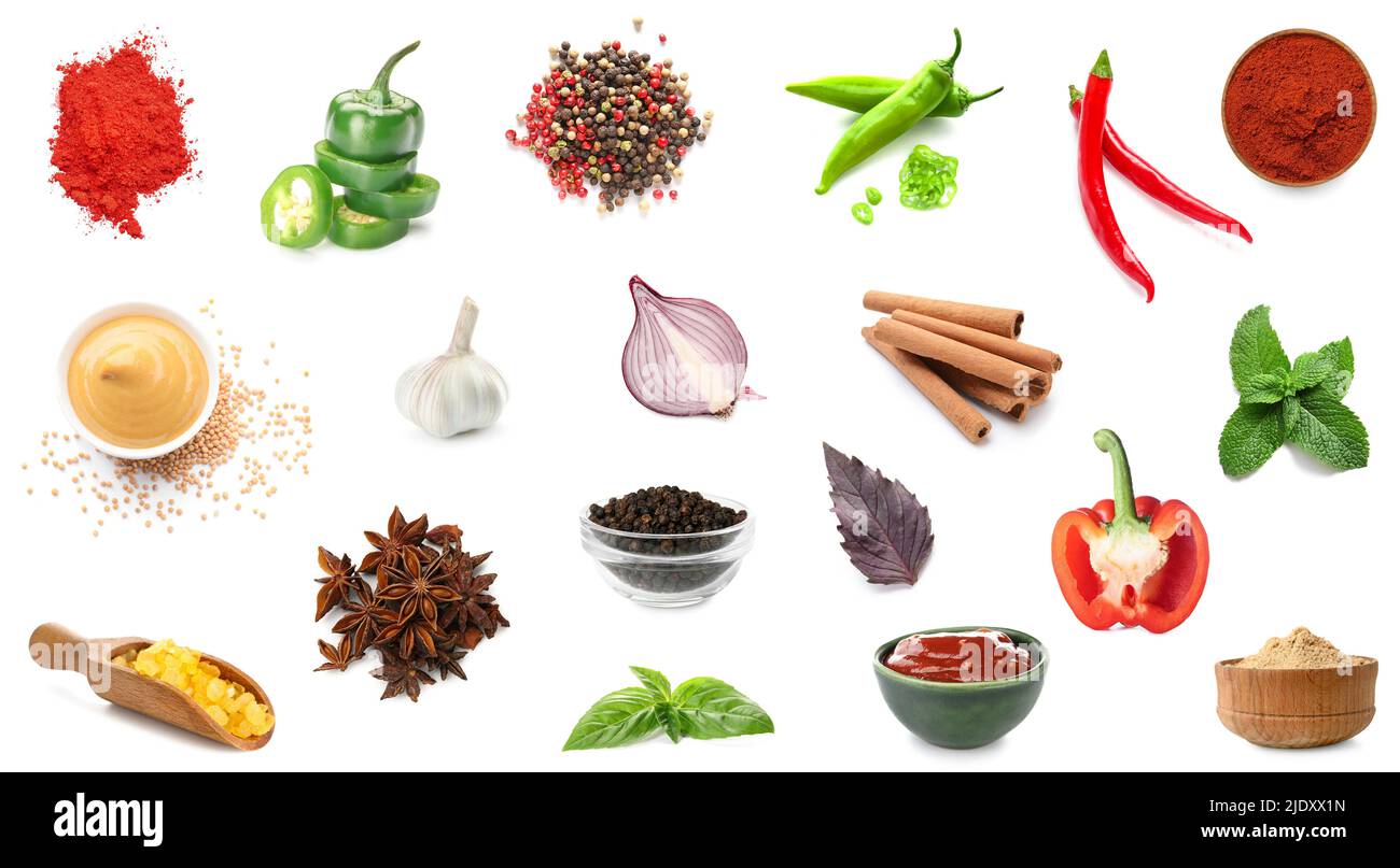 Set of aromatic spices with fresh vegetables, herbs and sauces on white ...