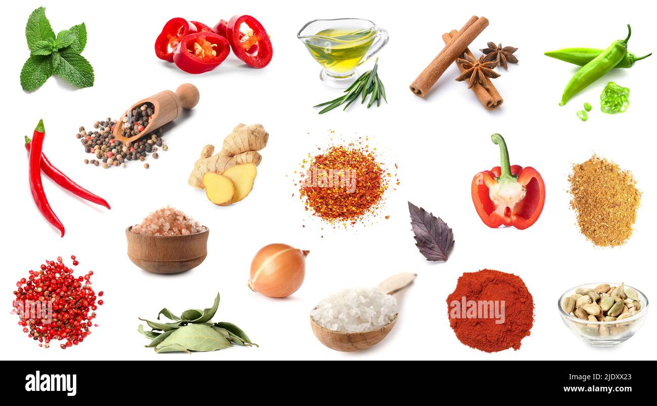 Set of aromatic spices with fresh vegetables, herbs and oil on white ...