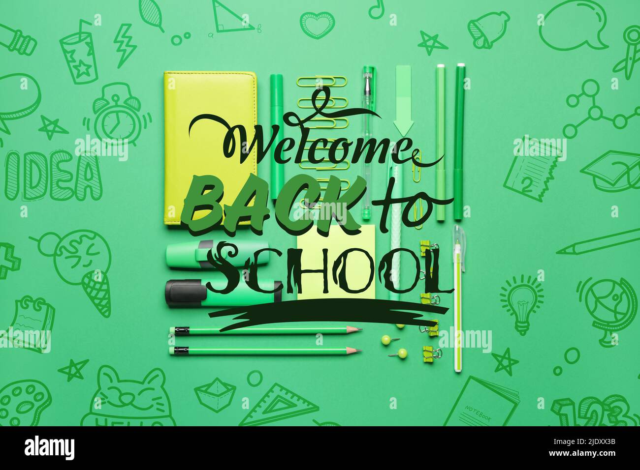 Text WELCOME BACK TO SCHOOL and set of stationery on green background ...