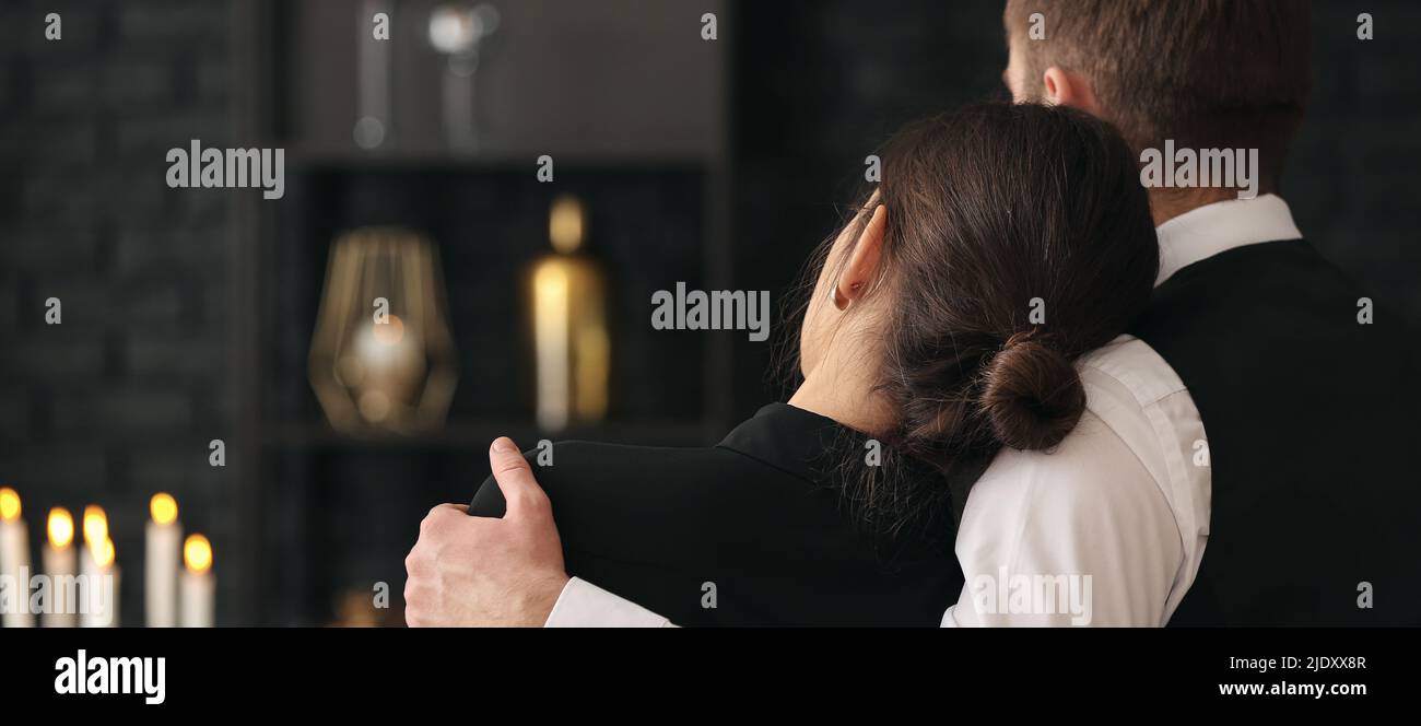 Couple pining after their relative at funeral Stock Photo - Alamy