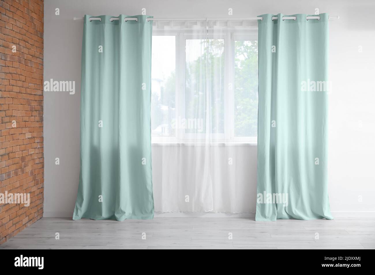 Beautiful curtains in cozy empty room Stock Photo - Alamy