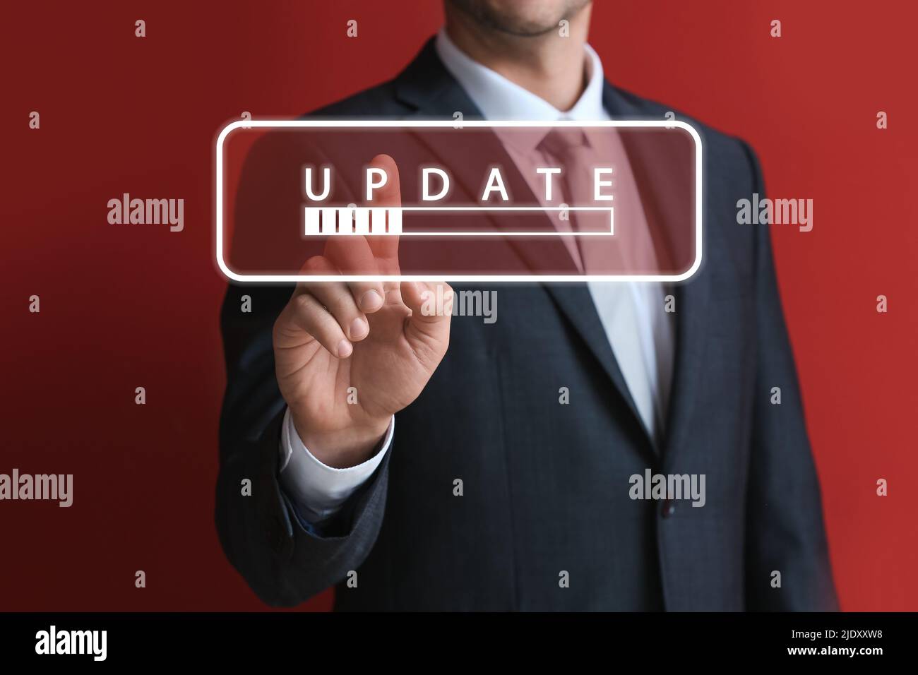 Businessman touching virtual screen with word UPDATE and status bar on ...
