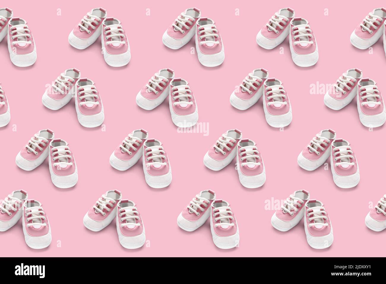 Many baby booties on pink background. Pattern for design Stock Photo ...