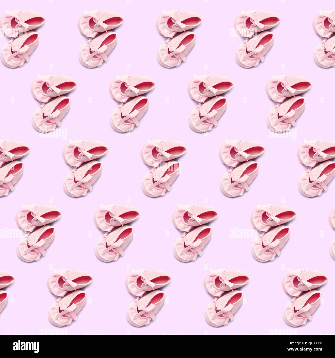 Many baby booties on pink background. Pattern for design Stock Photo ...