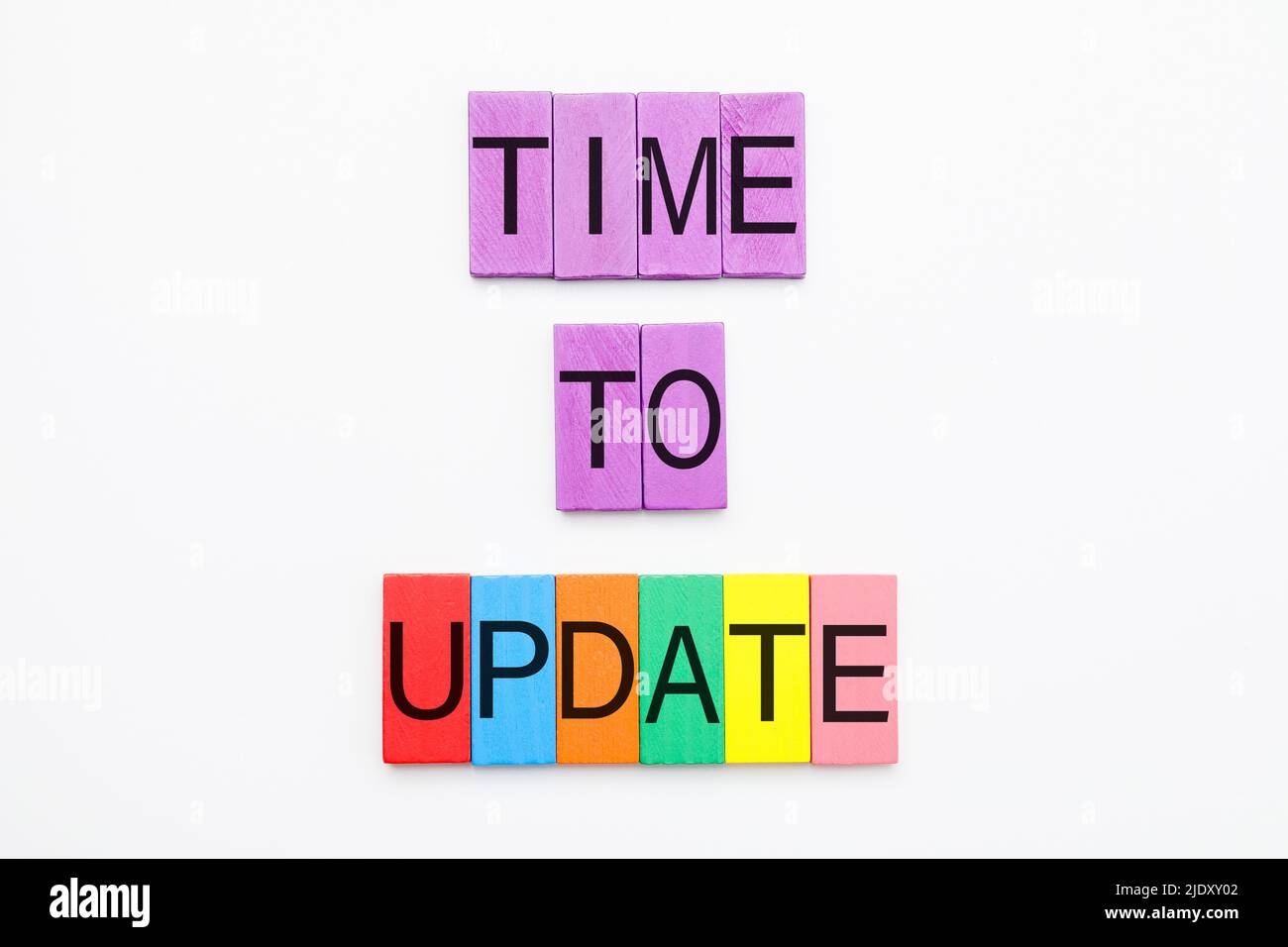 Text TIME TO UPDATE made of colorful wooden blocks on white background ...