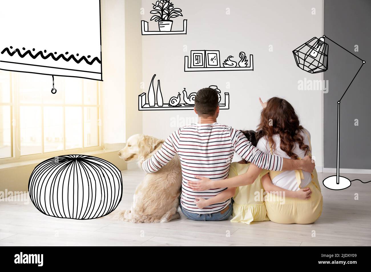 Happy family with dog planning new design of their new flat Stock Photo ...
