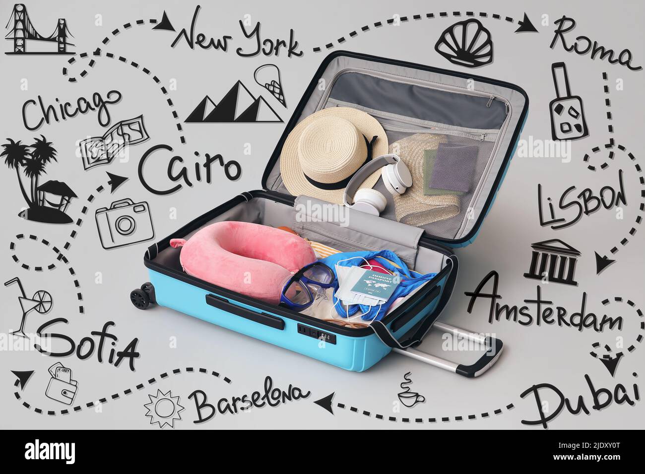 Open packed suitcase on grey background with drawn travel route Stock ...
