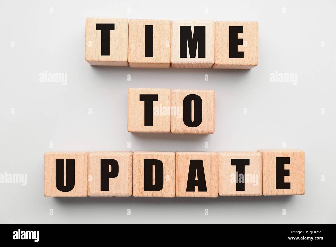 Text TIME TO UPDATE made of wooden cubes on white background Stock ...