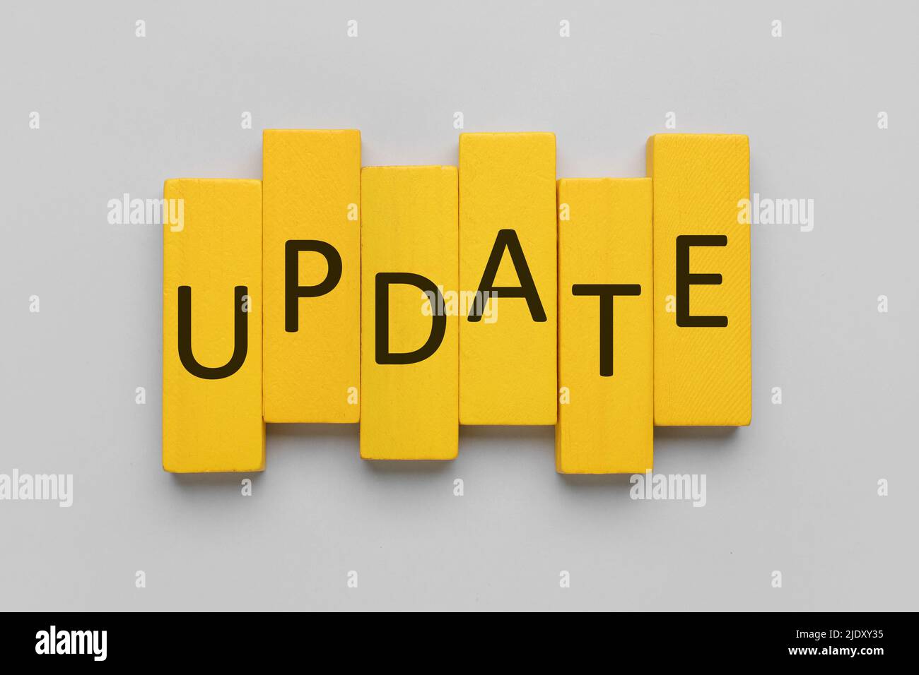 Text UPDATE made of yellow blocks on light background Stock Photo - Alamy
