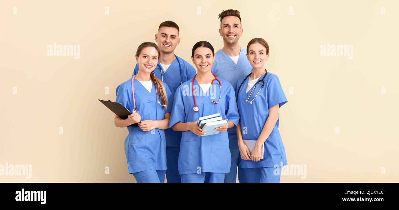 Group of medical students on light color background Stock Photo - Alamy