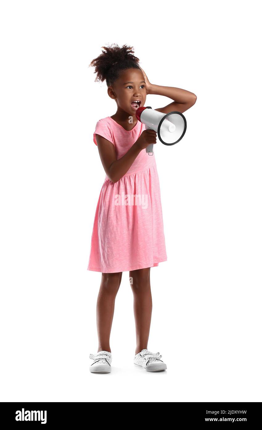 Little African-American girl shouting into megaphone on white ...
