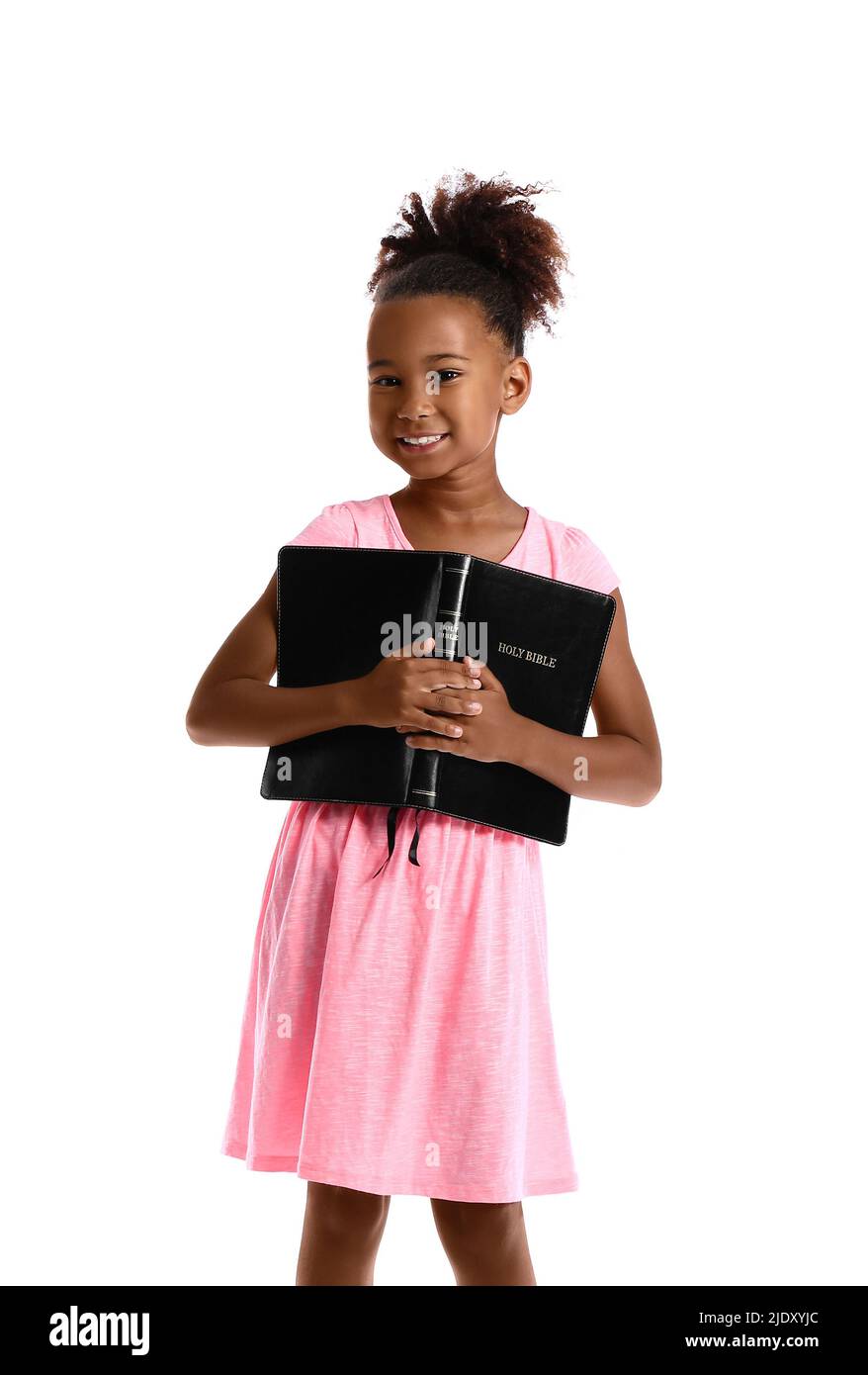 Little African-American girl with Holy Bible on white background Stock ...