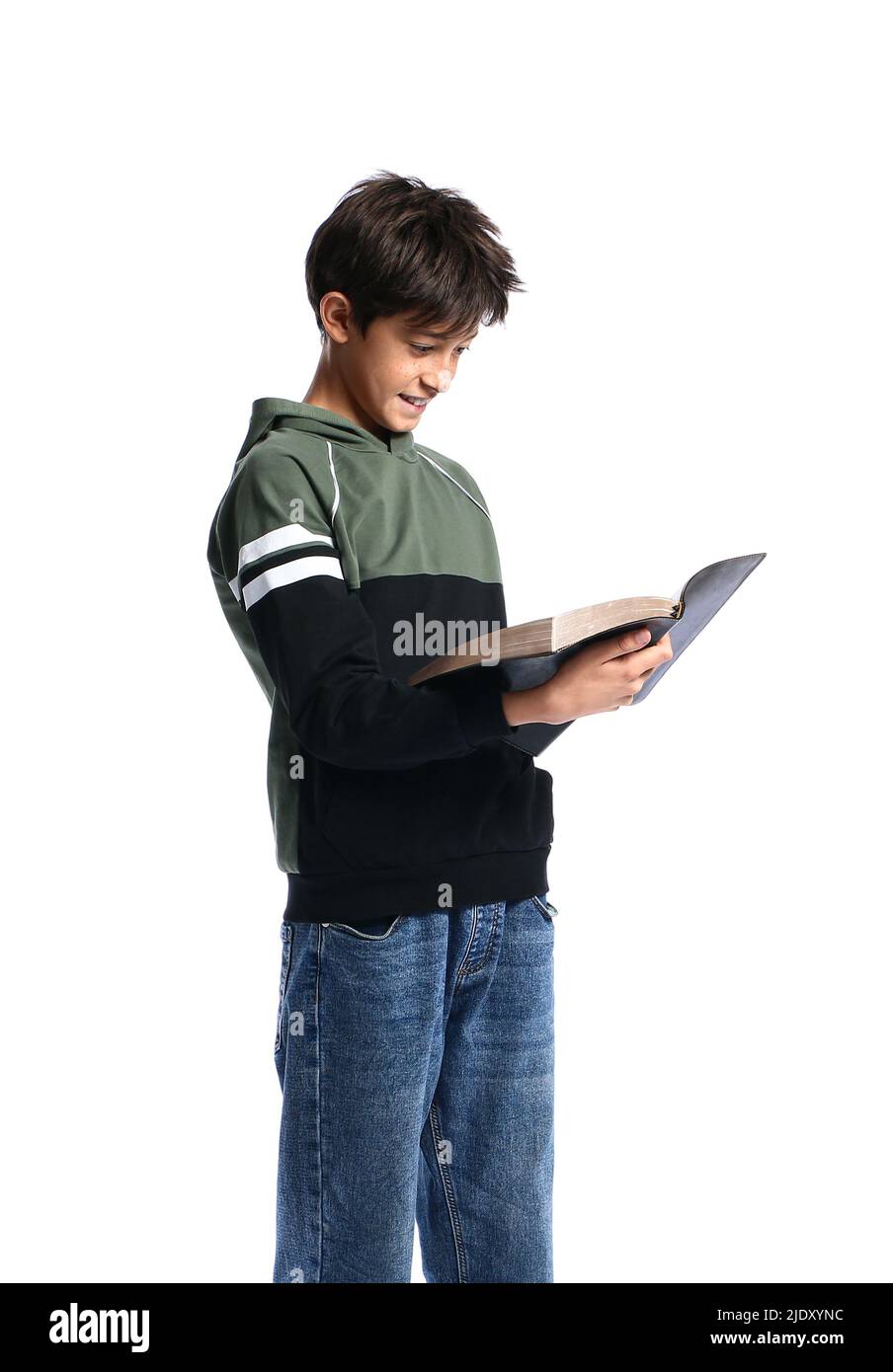 Teenage boy reading Holy Bible on white background Stock Photo - Alamy