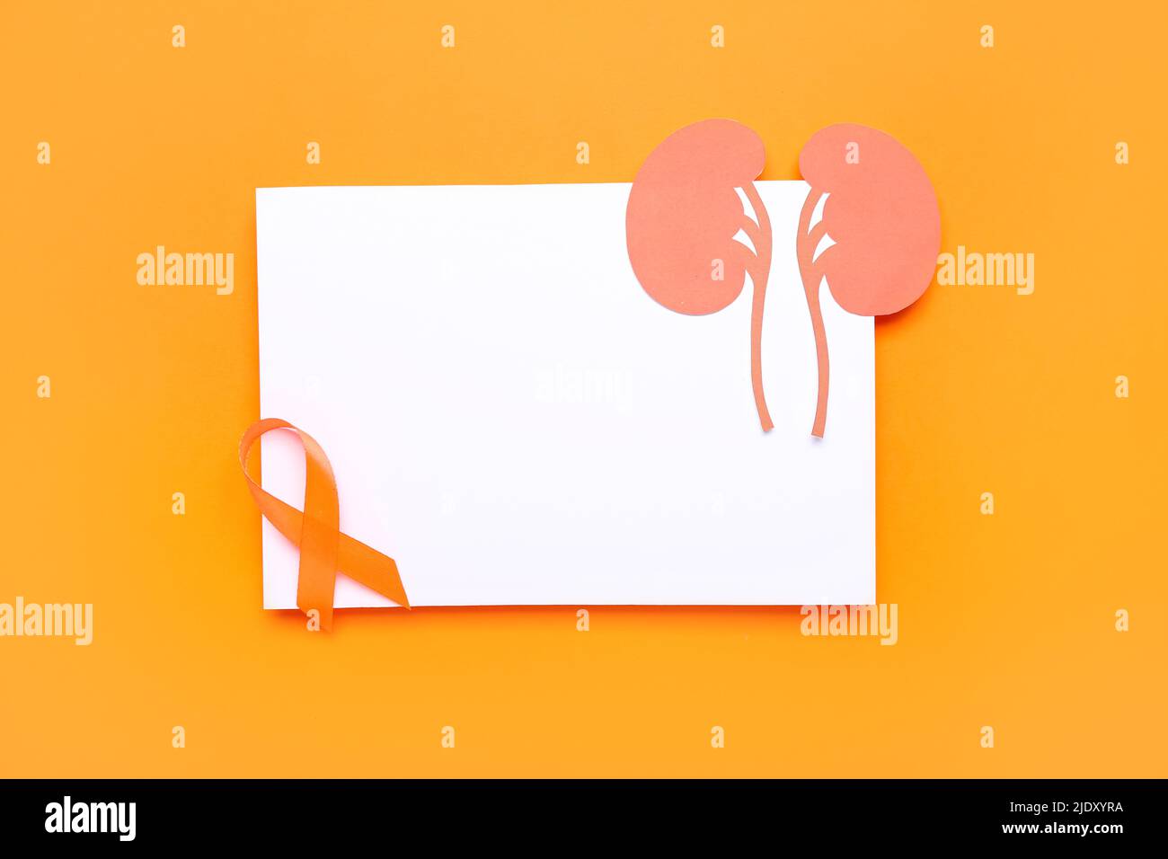 Blank paper sheet with awareness ribbon and paper kidneys on orange ...