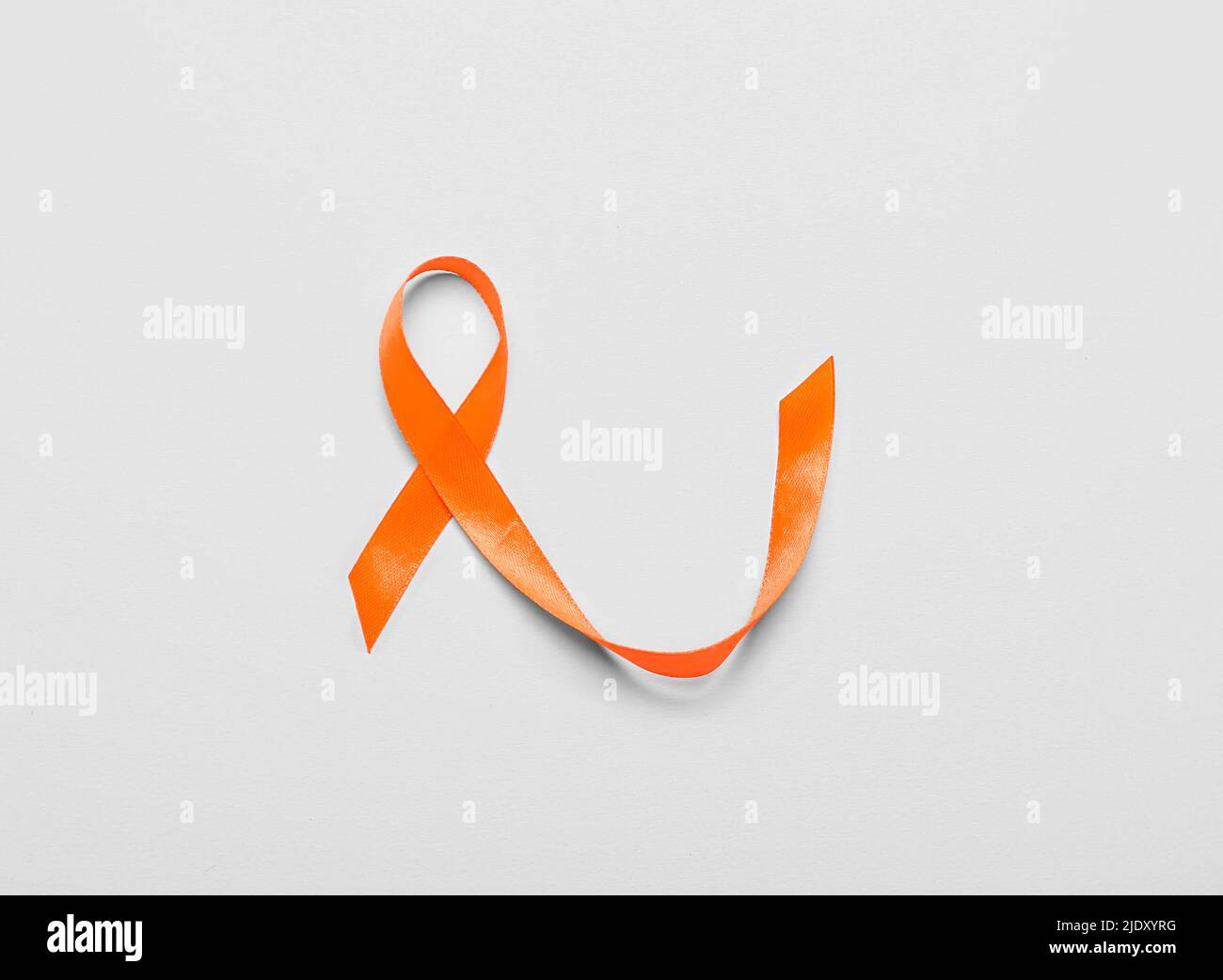 Orange awareness ribbon on grey background. Kidney cancer concept Stock ...
