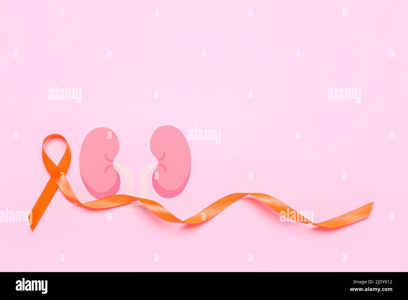 Orange awareness ribbon and paper kidneys on pink background Stock ...