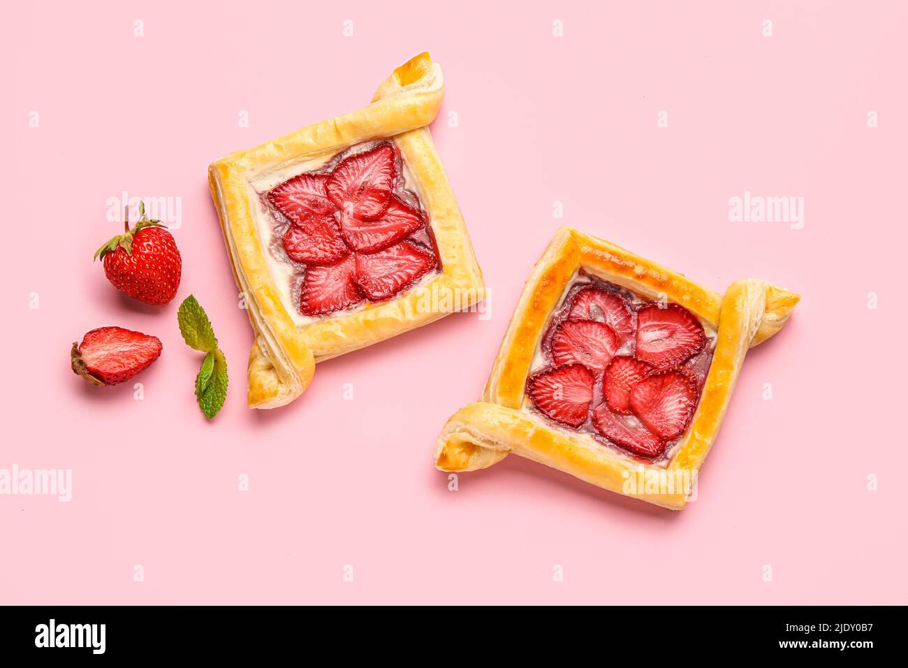 Delicious strawberry puff pastry on pink background Stock Photo - Alamy