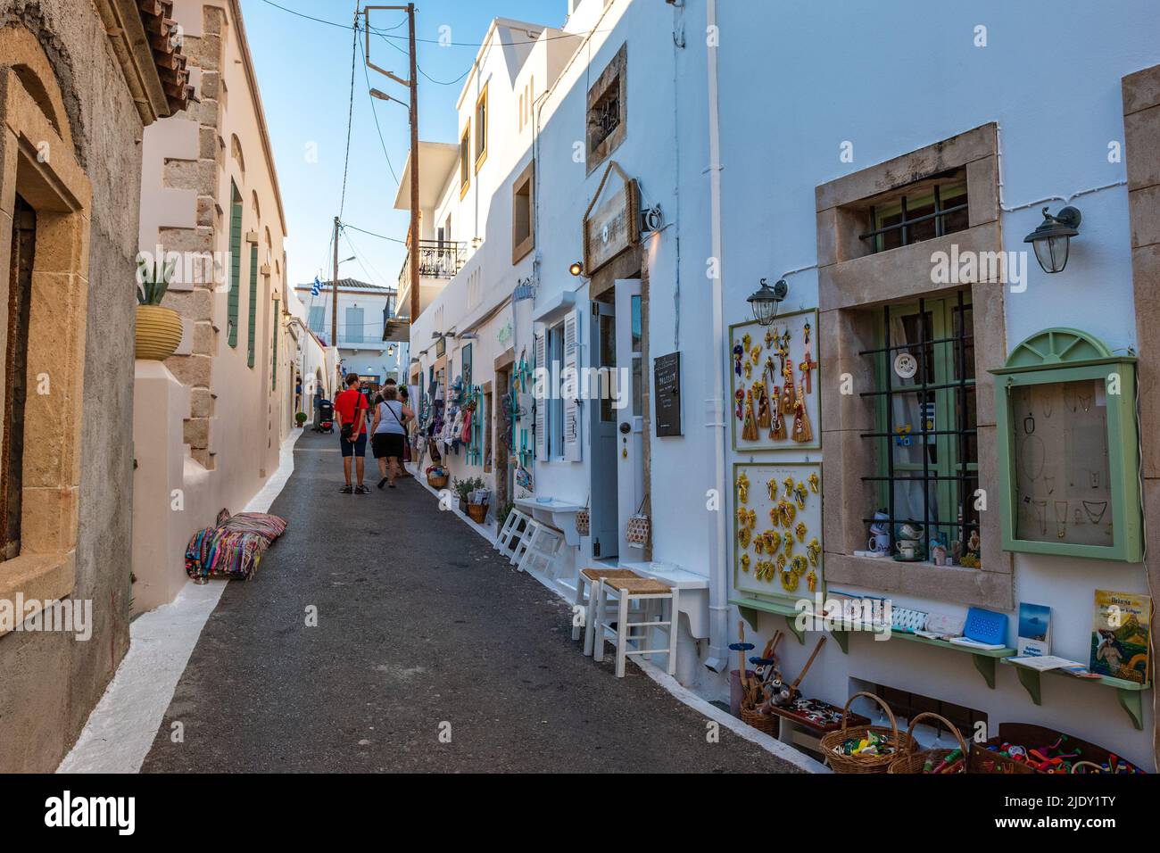 Architectural buildings with people walking by the the streets of Chora ...