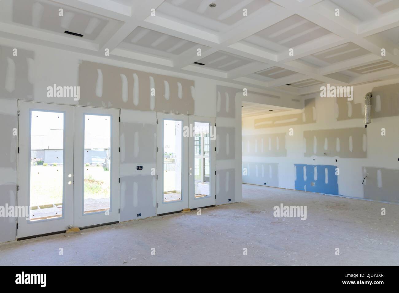 A newly constructed house is using the finishing putty applied to its ...