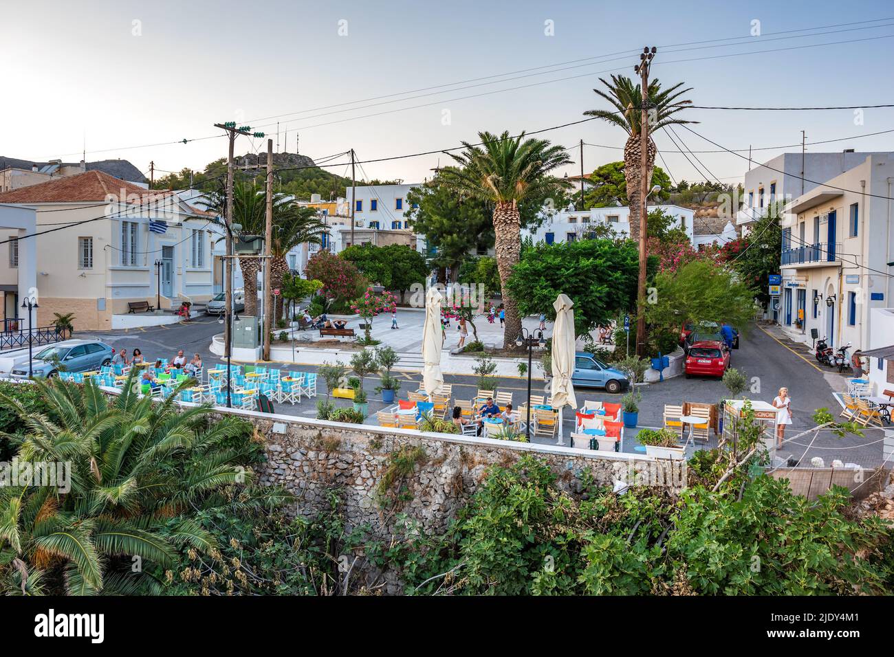Architectural buildings with people walking by the the streets of Chora ...
