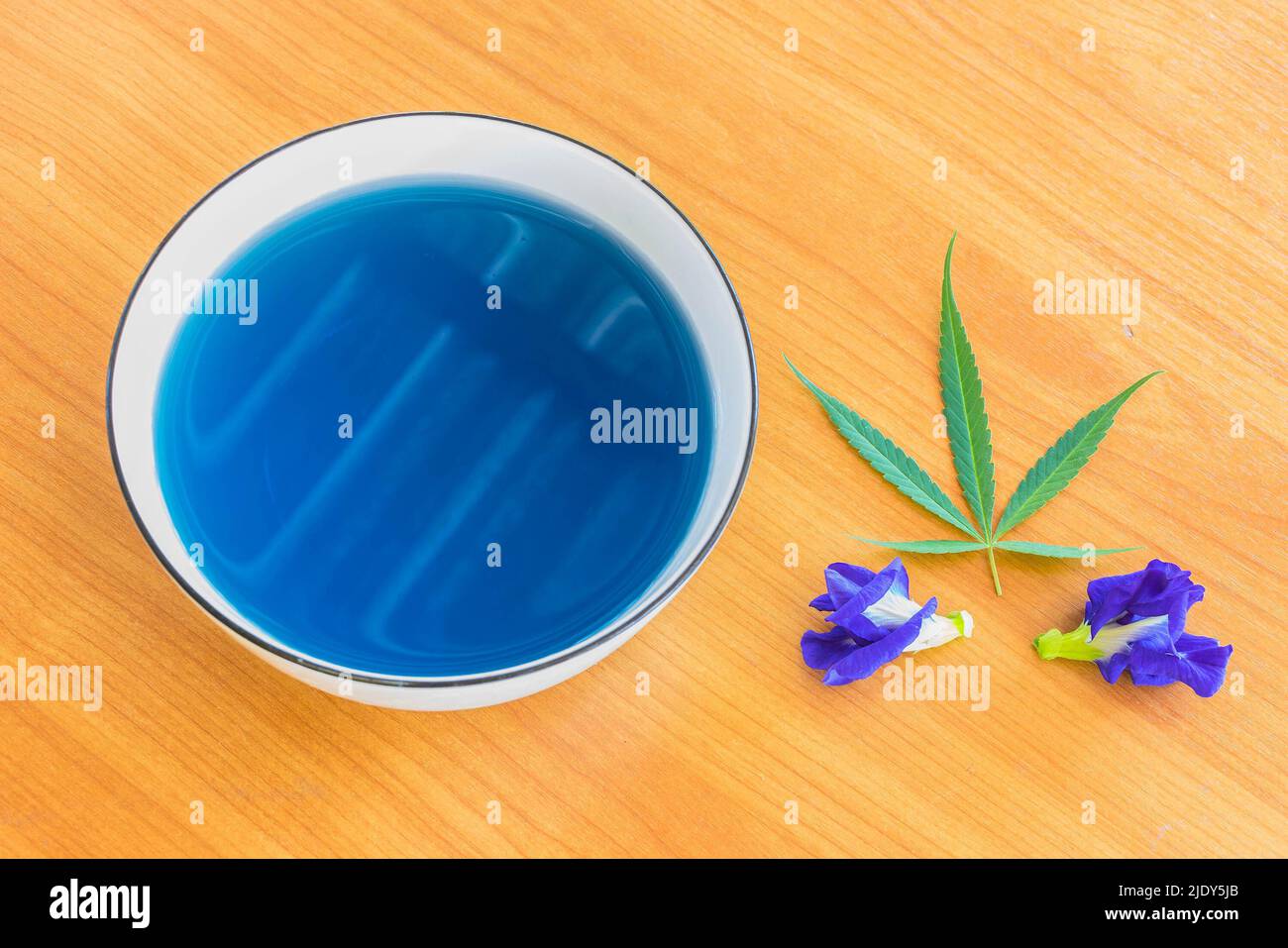 Cannabis ,Marijuana and Blue Pea, herb hot tea on the bowl with ...